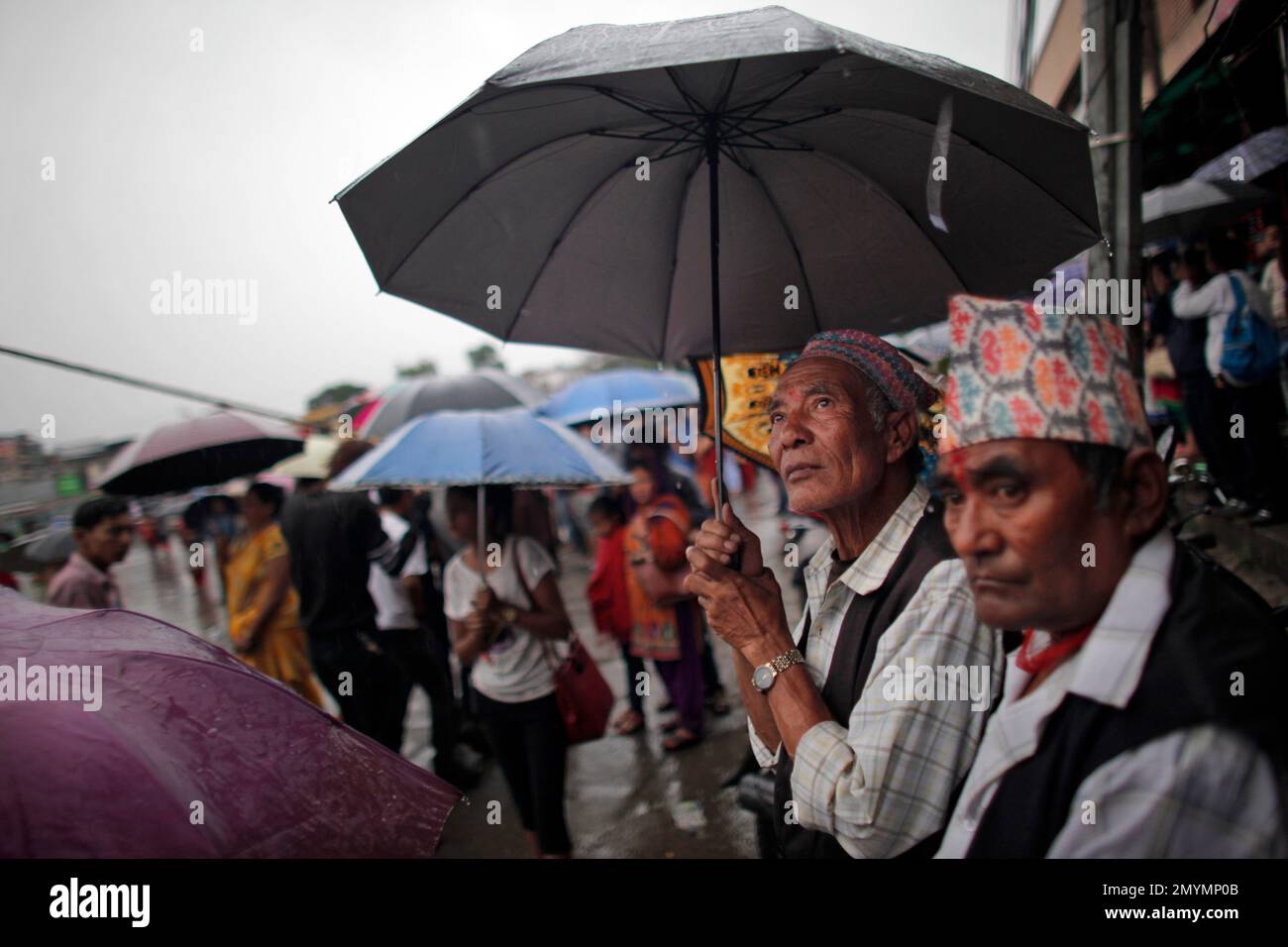 Nepalese people watch the Rato Machindranath chariot festival in ...