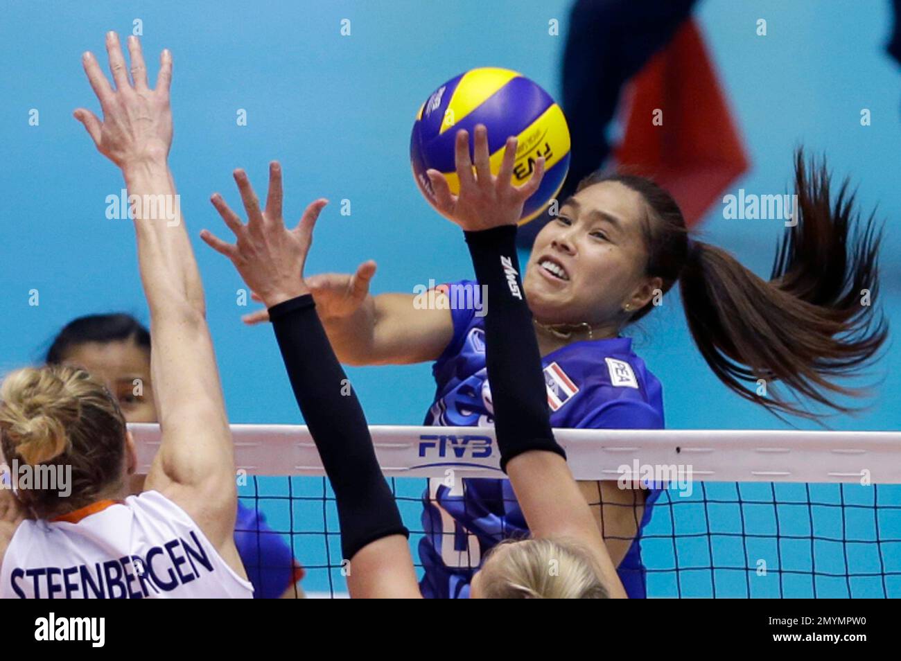 Onuma Sittirak of Thailand spikes against Quinta Steenbergen, left, and ...