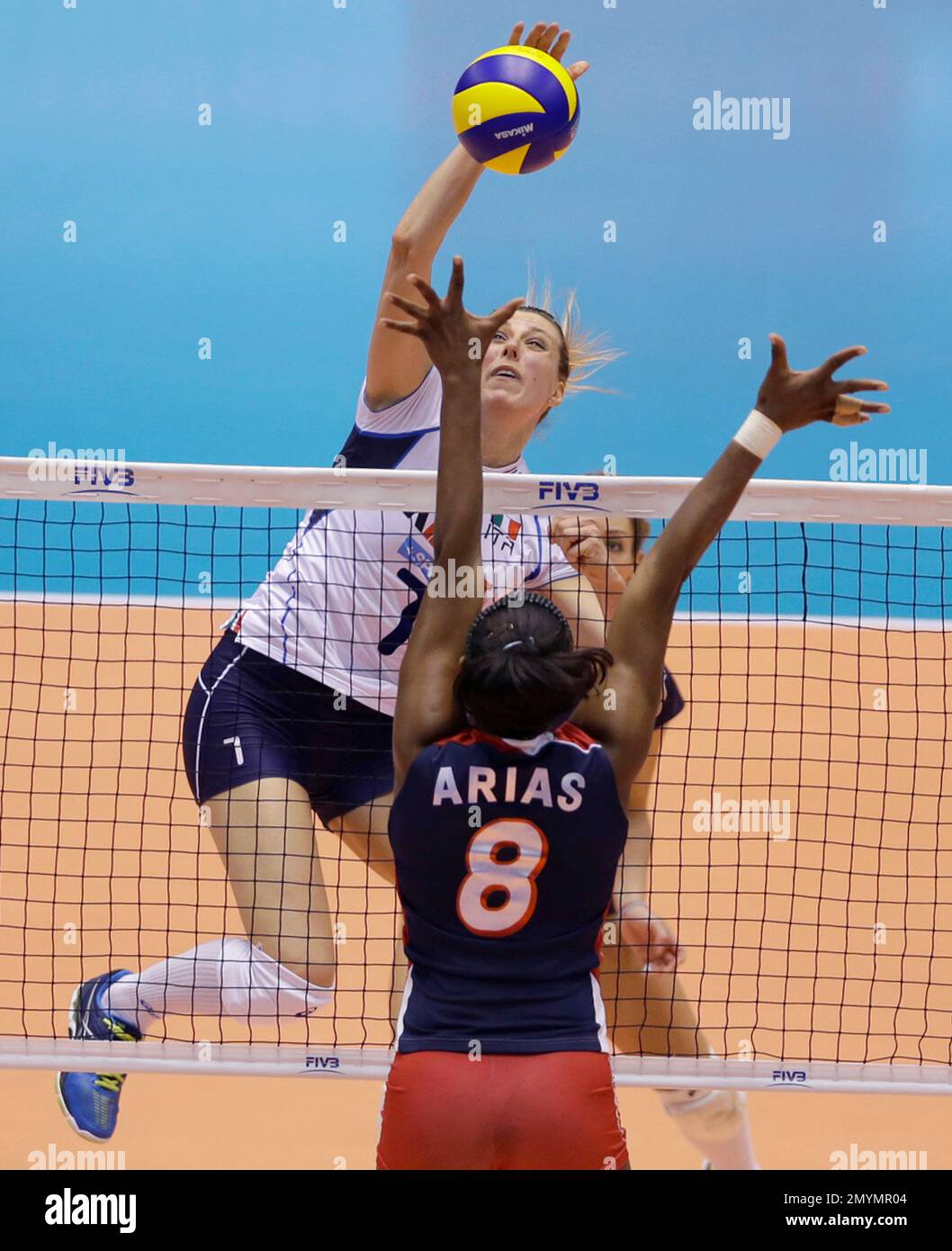 Martina Guiggi of Italy spikes against Candida Estefany Arias Perez of ...
