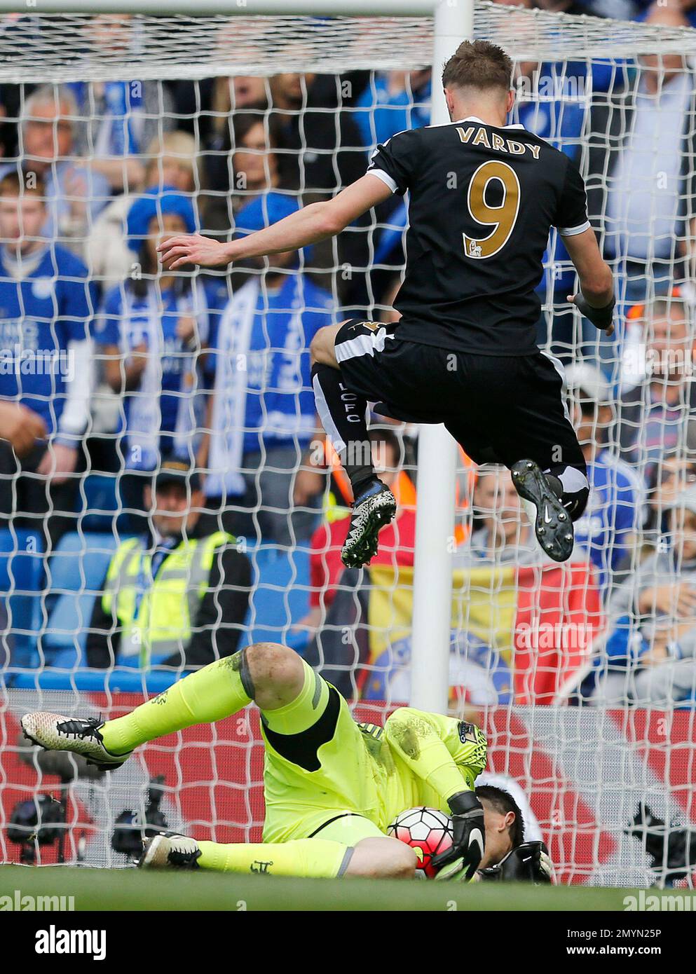 Leicester's Jamie Vardy jumps over Chelsea goalkeeper Thibaut Courtois ...