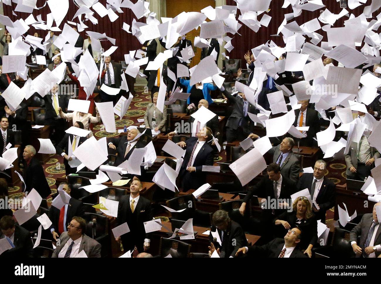 Members of the Missouri House of Representatives throw papers in the ...