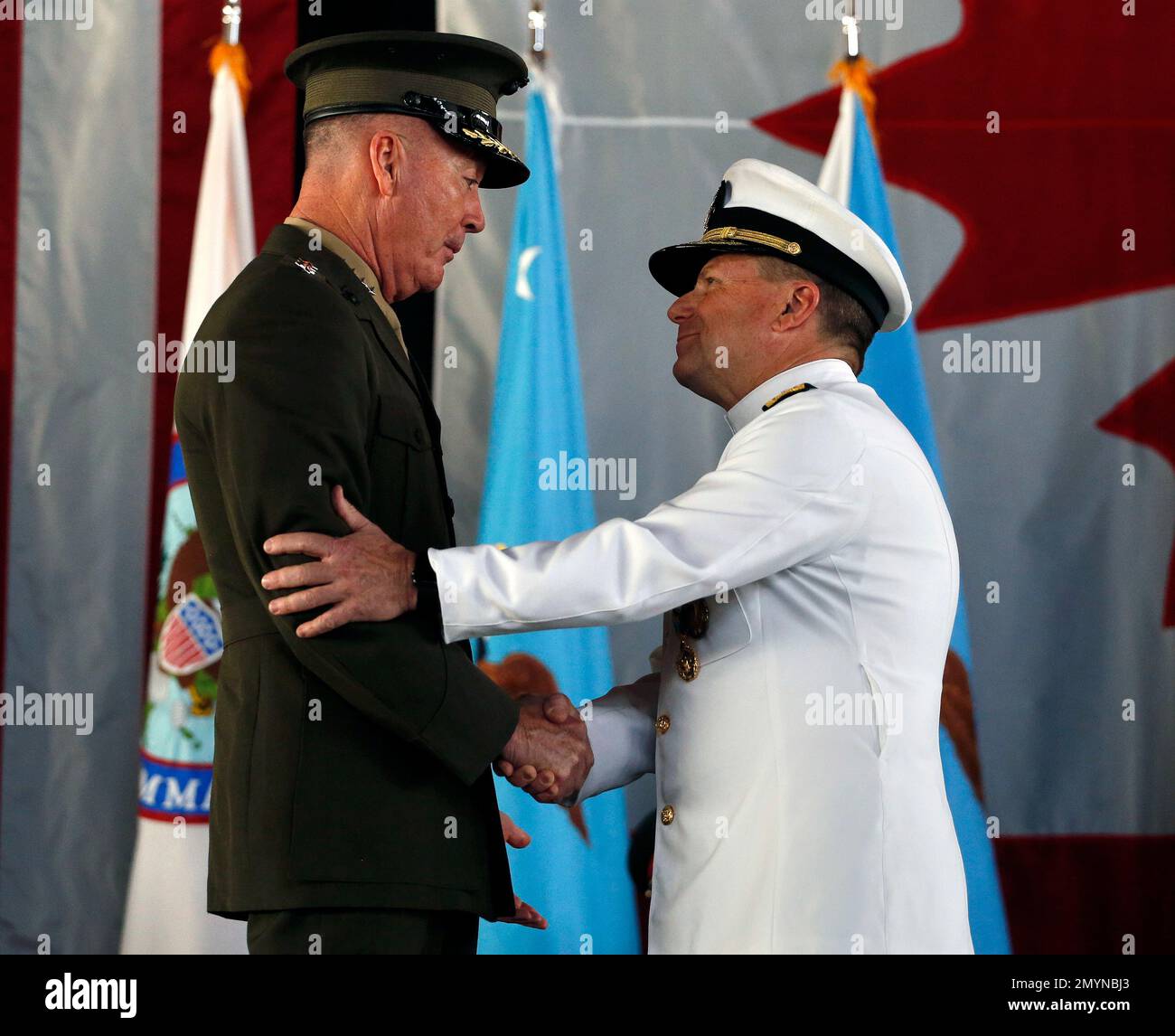 Navy Adm. William E. Gortney, right, the outgoing commander of the ...
