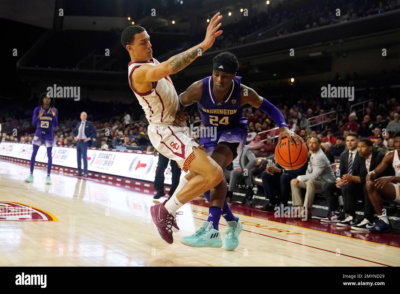 Southern California forward Kobe Johnson, left, draws a charge on ...