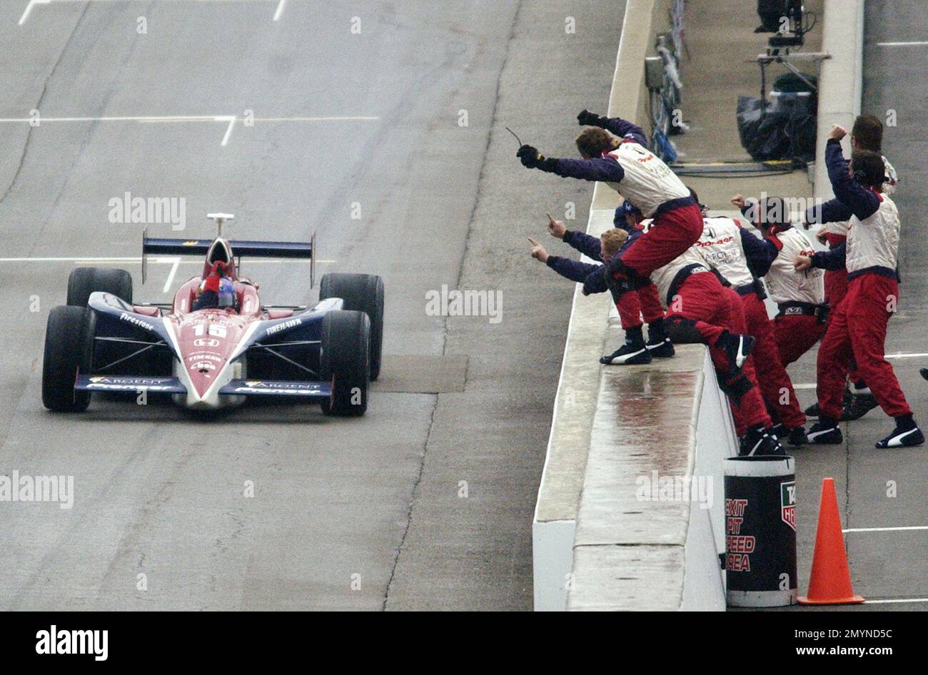 FILE - In this May 30, 2004, file photo, Buddy Rice's crew comes out to ...