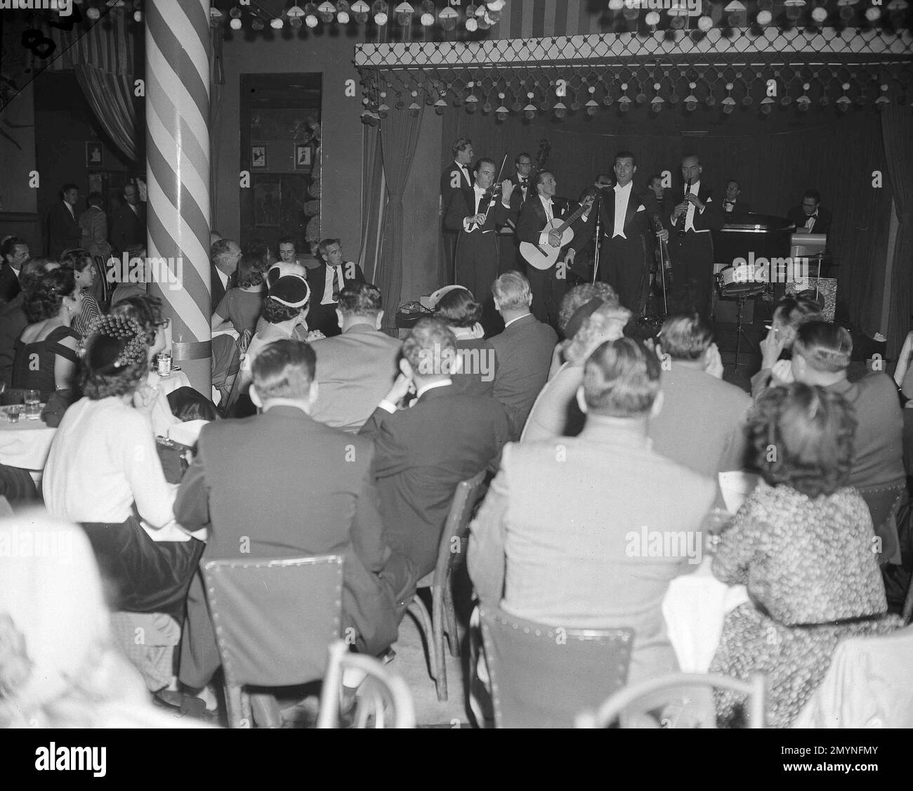 The audience takes in a show at the Mocambo nightclub in the West ...