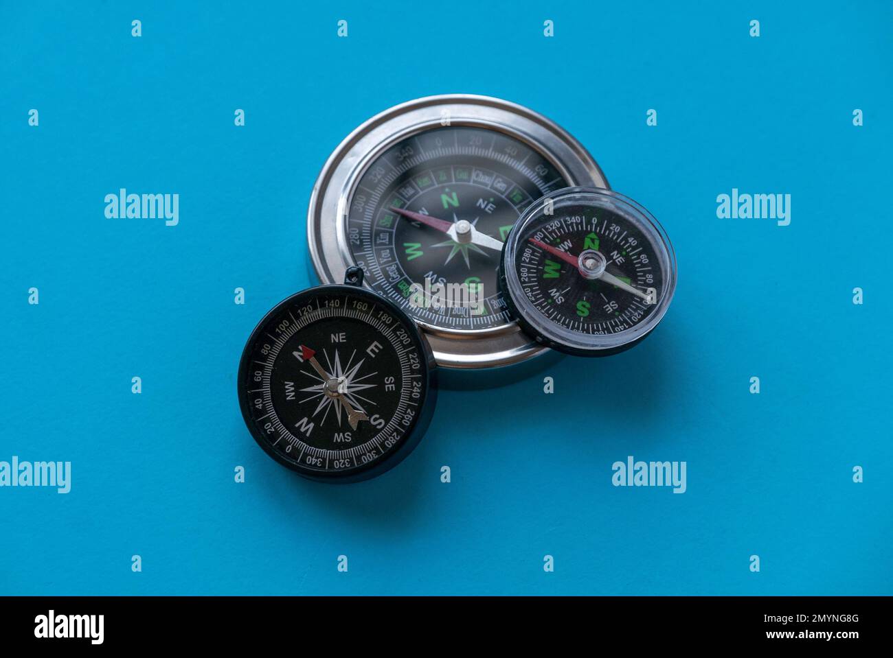 Black compass on blue background hi-res stock photography and images ...