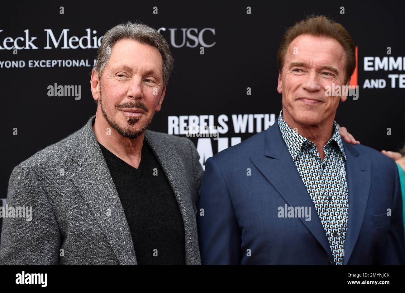 Oracle founder Larry Ellison, left, poses with Arnold Schwarzenegger at ...