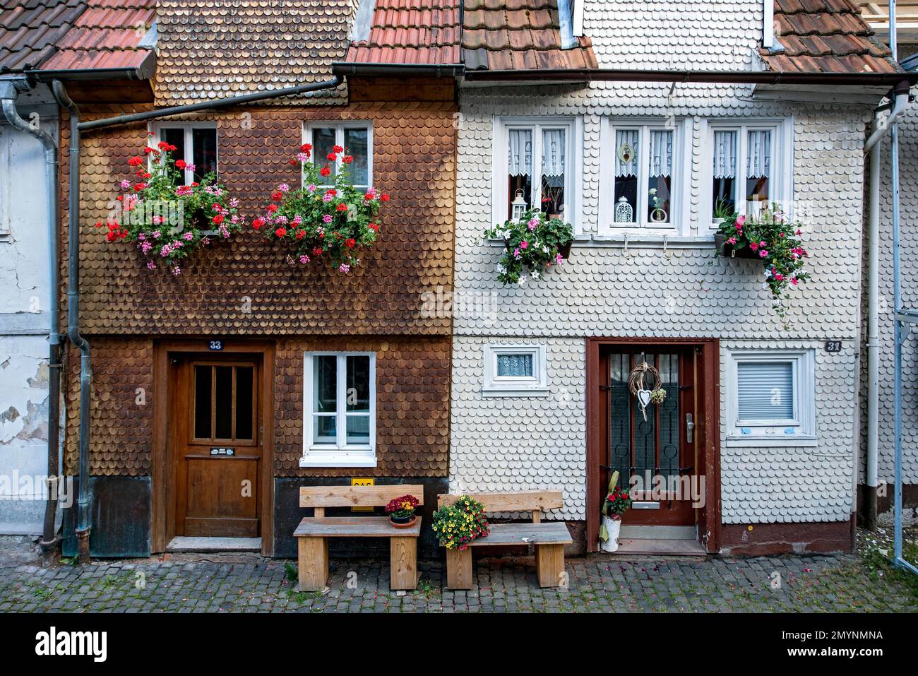 Historic shingle houses decorated with flowers, Am Graben, Old Town ...
