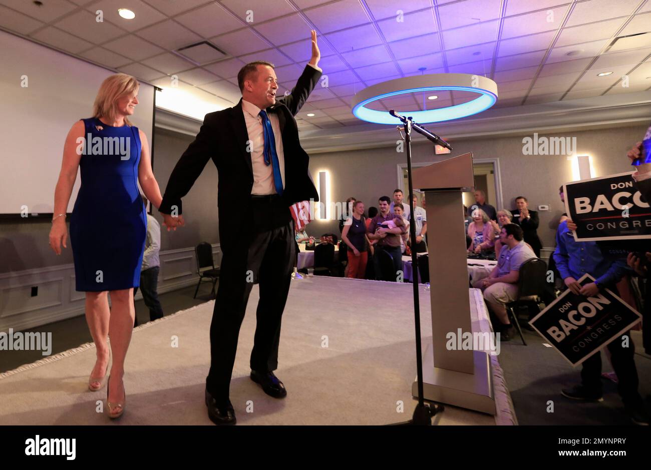 Retired Air Force Brig. Gen. Don Bacon waves to supporters with his ...