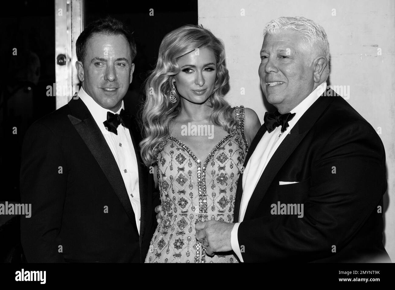 Michael Cominotto, left, Paris Hilton, and Dennis Basso attend the ...