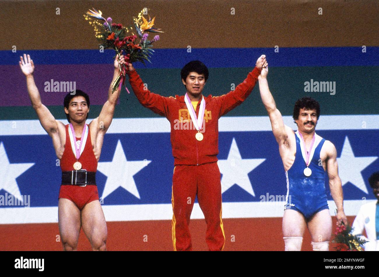 Chen Weiqiang of China, center, celebrates after winning the gold medal ...