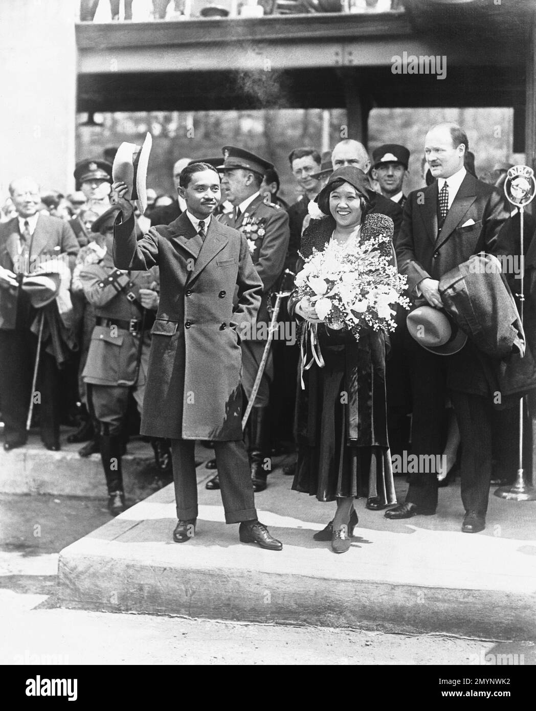 King Prajadhipok and his wife Queen Rambhai of Thailand acknowledge the ...
