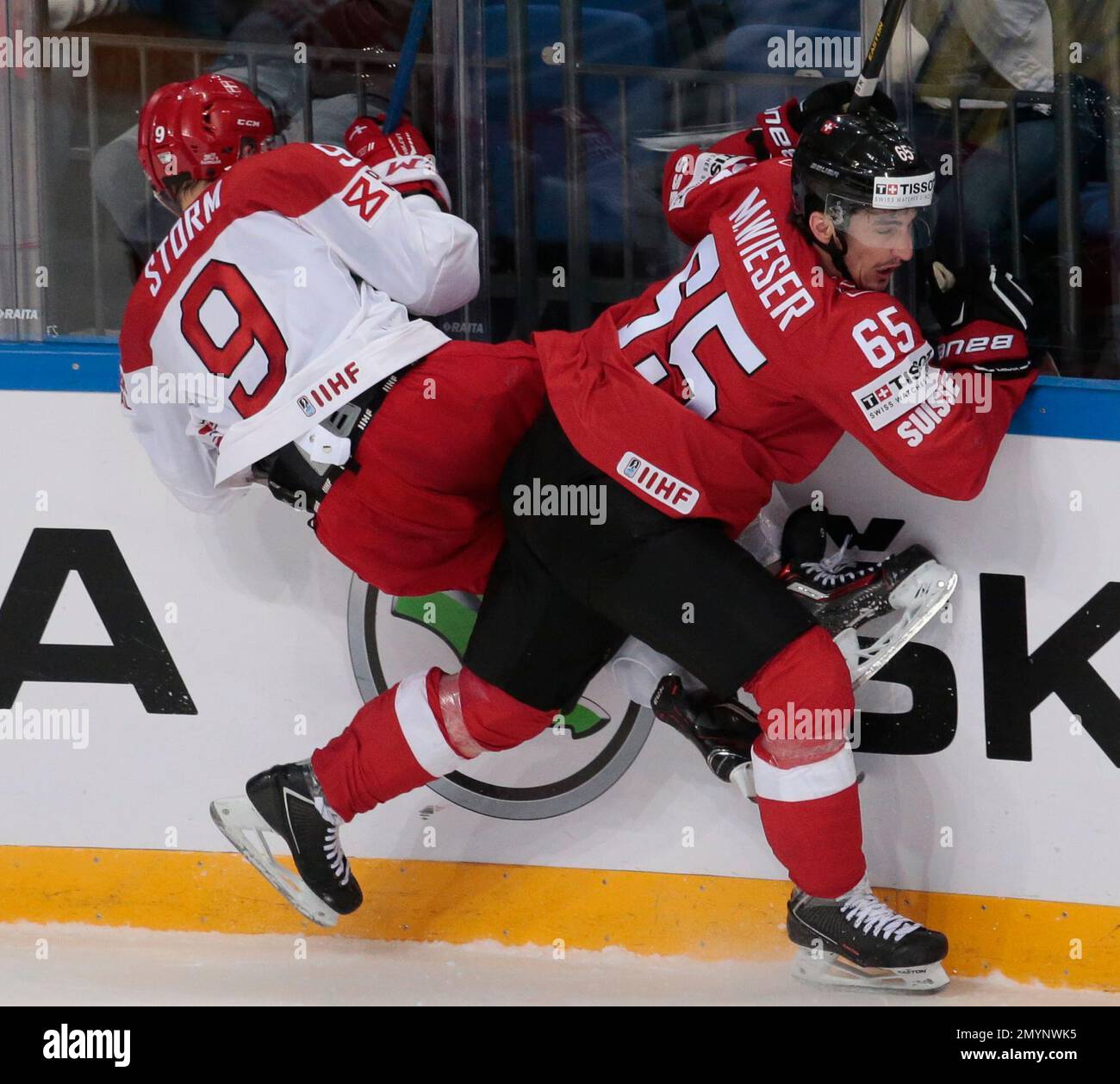 Switzerland’s Marc Wieser, right, boards Denmark’s Frederik Storm ...