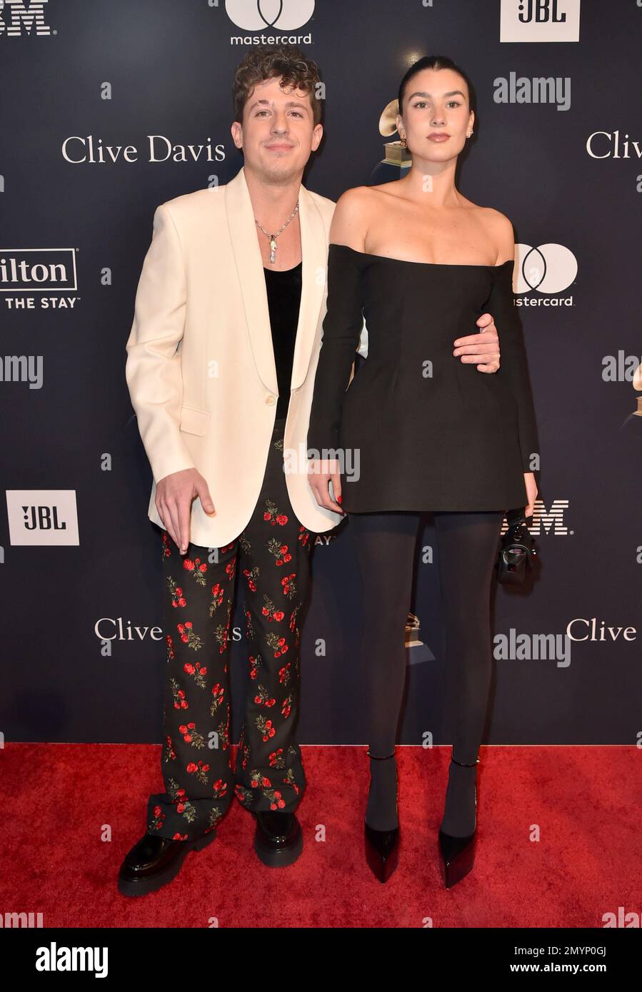 Charlie Puth, left, and Brooke Sansone arrive at the Pre-Grammy Gala on ...