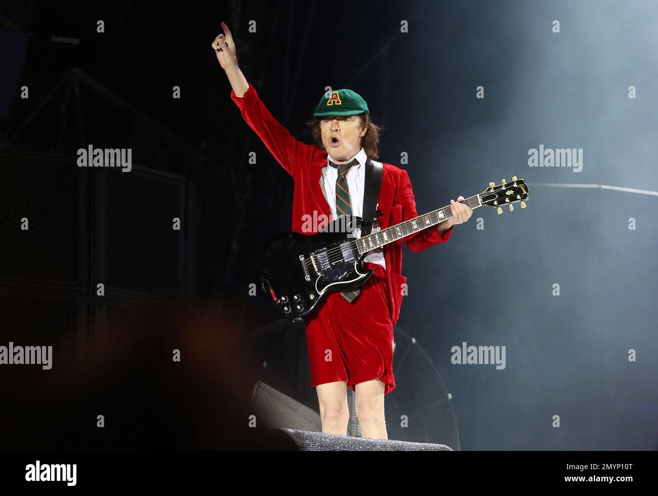 Lead guitar player Angus Young gestures during the concert of ...