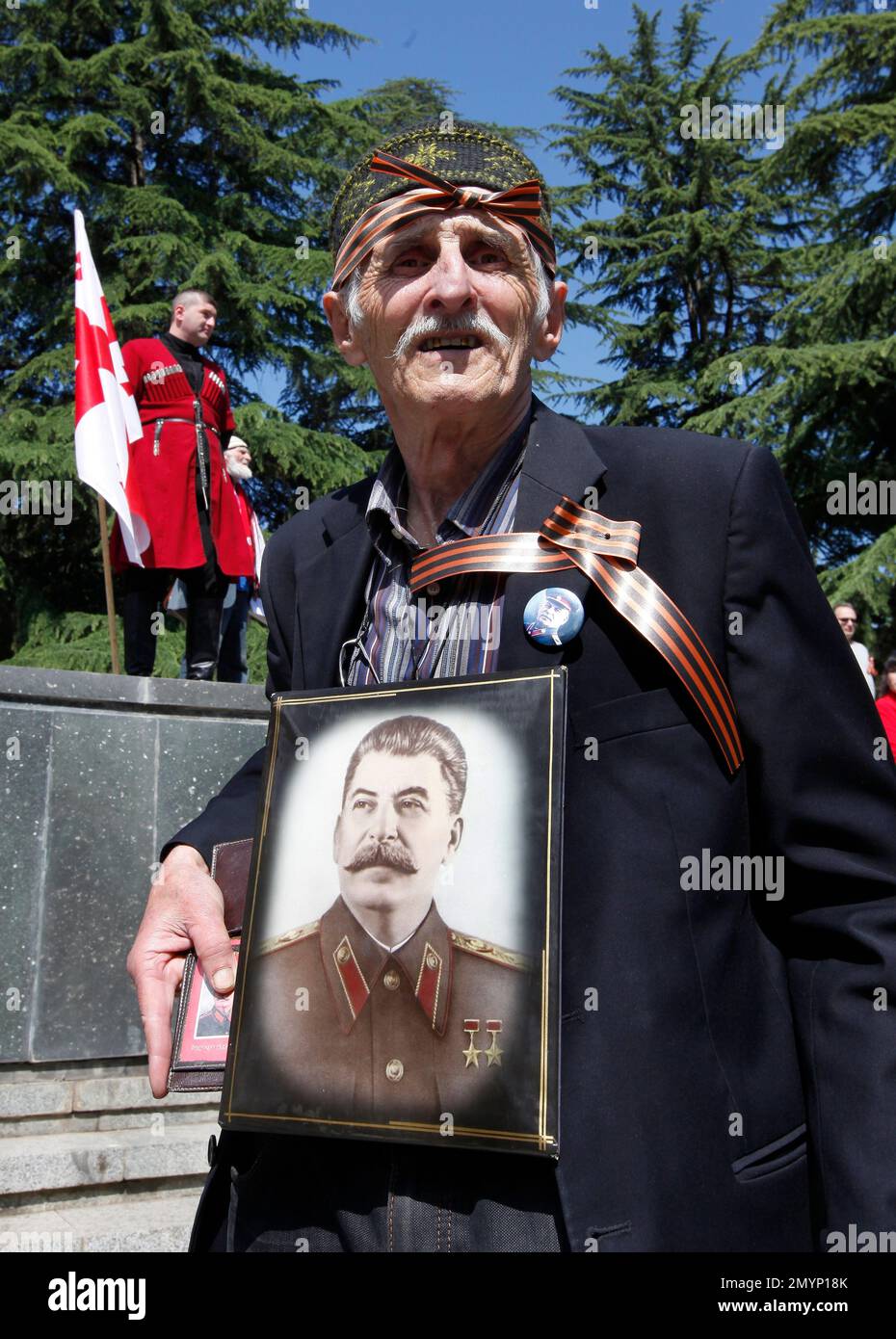 A Georgian man, wearing a ribbon symbolizing the Soviet victory in WWII ...