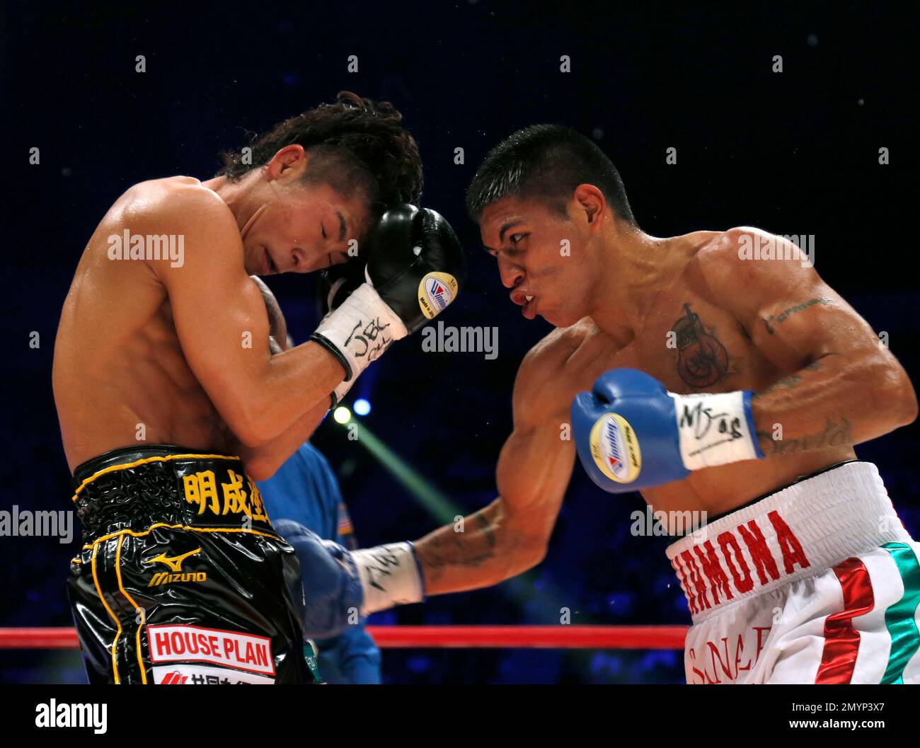Japanese champion Naoya Inoue, left, fights with Mexican challenger ...