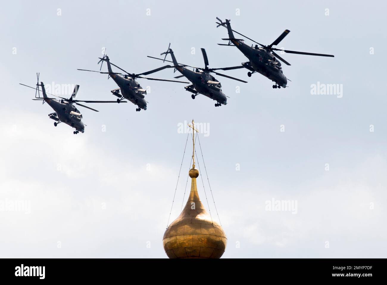 Russian military helicopters fly over the St. Basil's Cathedral during ...