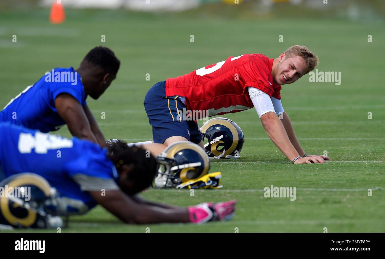 Los Angeles Rams quarterback Jared Goff, right, stretches with tight ...