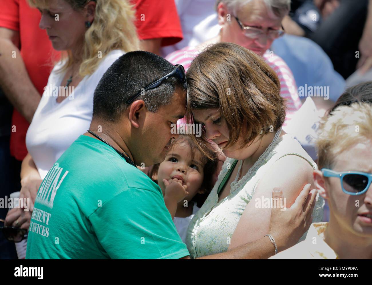 Participants pray during a National Day of Prayer event on the steps of ...