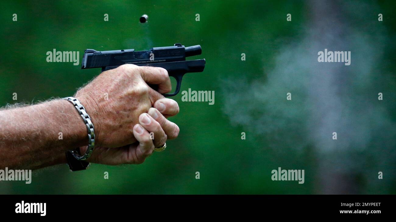 In this April 30, 2016 photograph, gun smoke and a spent round is ...