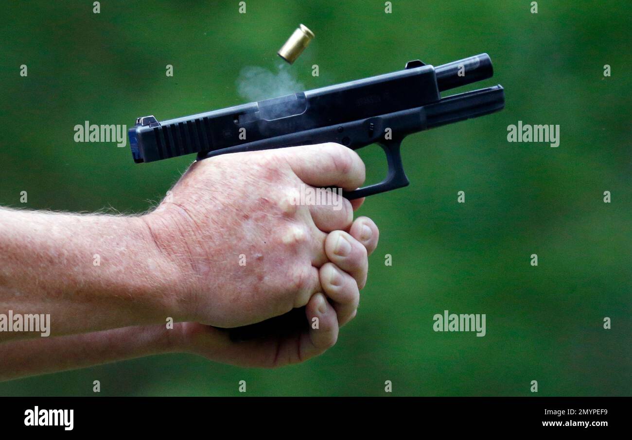 In this April 30, 2016 photograph, a spent round is ejected through gun ...