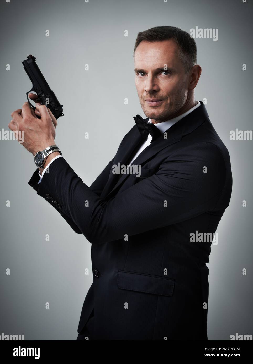 Portrait, gun and man in studio with weapon for power, crime or secret ...