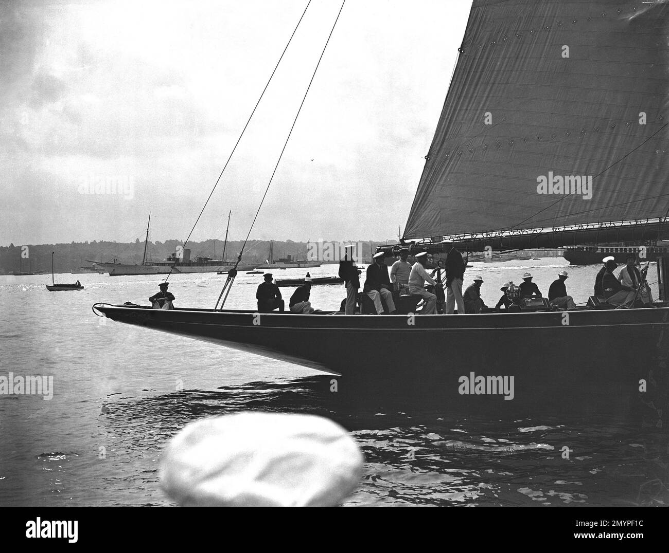 King George V, wearing a sailor's cap, chatting with Sir Philip Hunloke ...