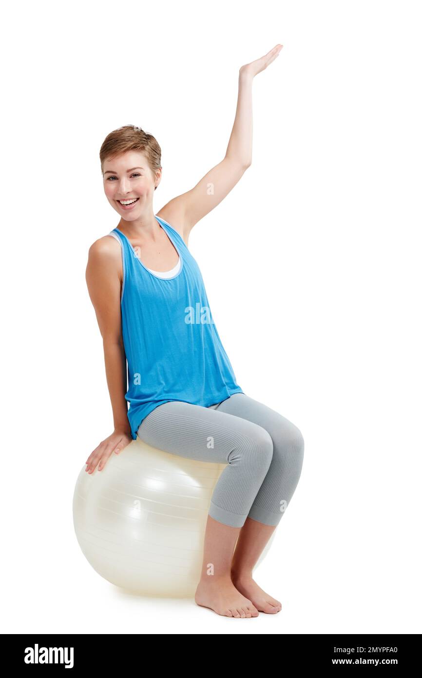 Exercise ball, portrait and woman in studio for fitness, advertising ...