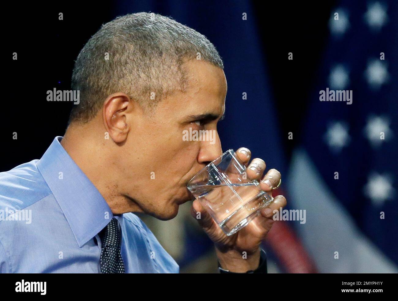 President Barack Obama takes a drink of water after speaking at ...