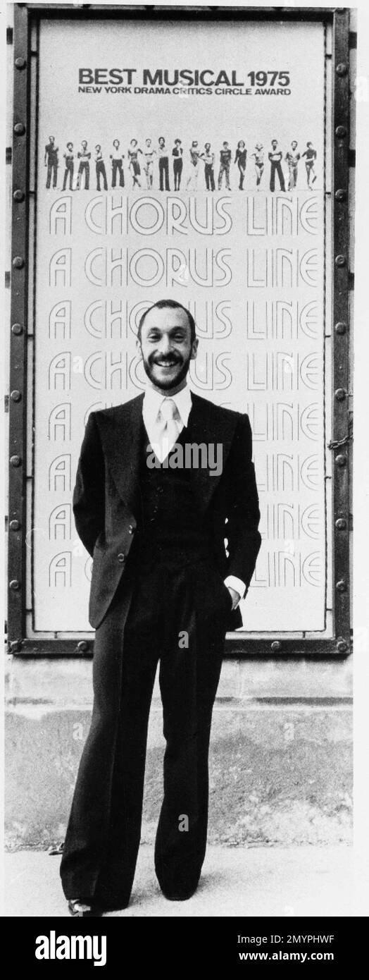 Director Michael Bennett stands in front of a billboard outside the ...