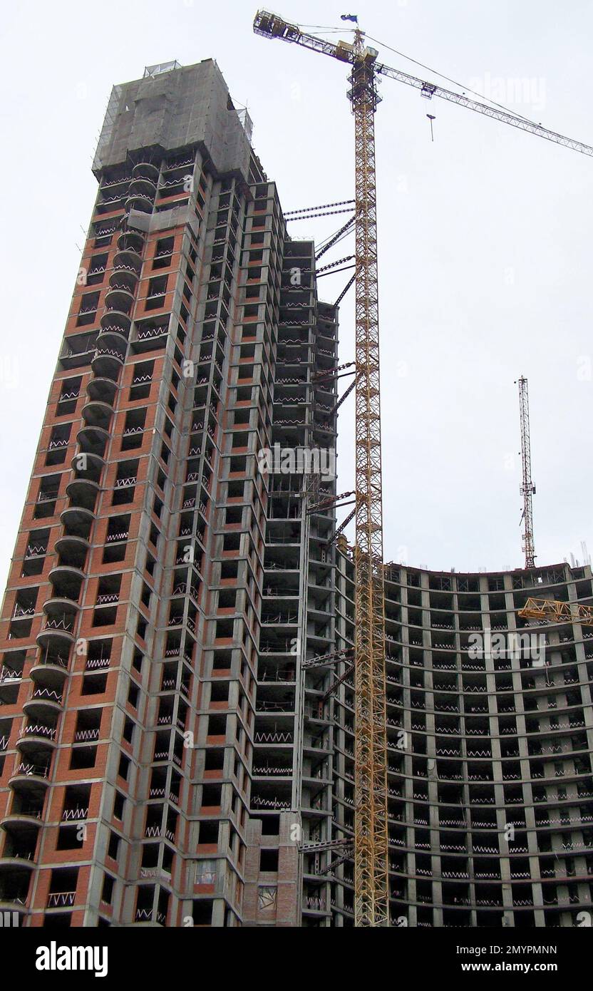 high rise construction with crane Stock Photo - Alamy