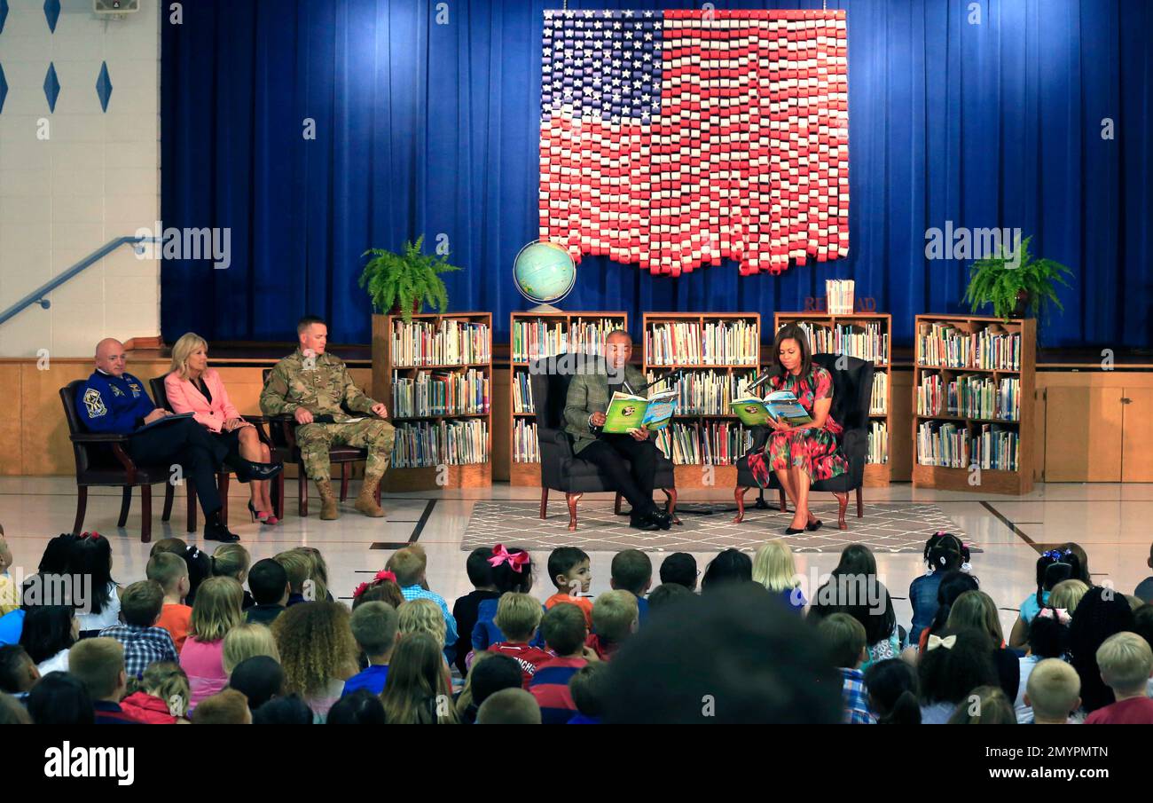 First lady Michelle Obama, right, reads with LeVar Burton to students ...