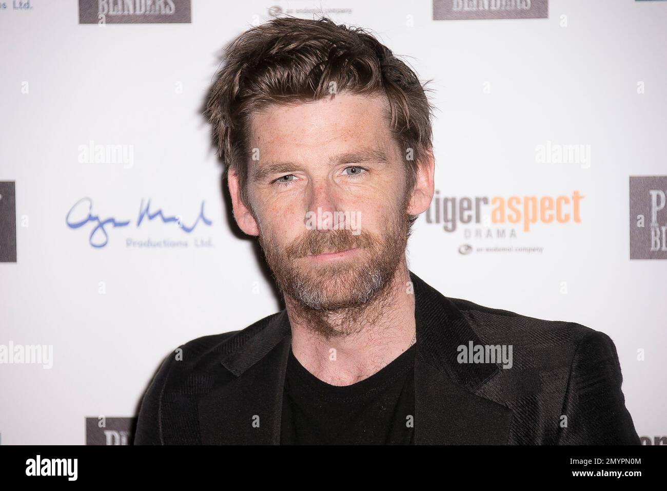 Actor Paul Anderson poses for photographers upon arrival at the ...