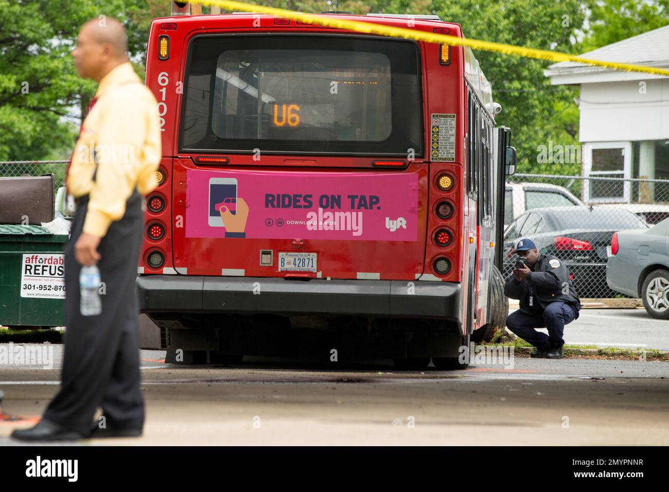 Police work a crime scene after authorities say a man attacked a bus ...