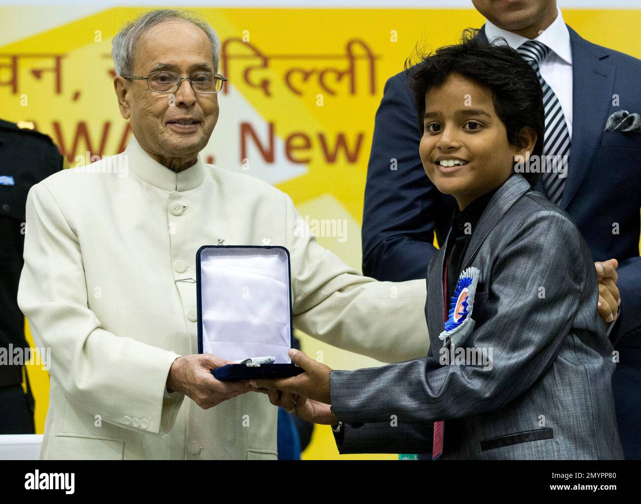 Best Child actor Gaurav Menon for movie 'Ben', right, receives the ...