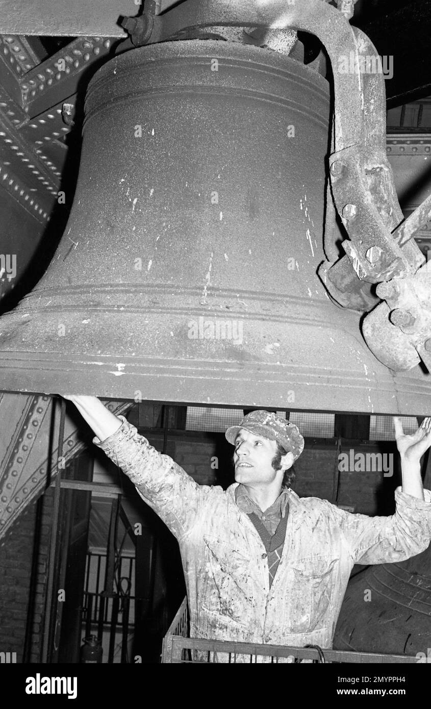 Painter John Stilling holds on to one of the bells inside Big Ben's ...
