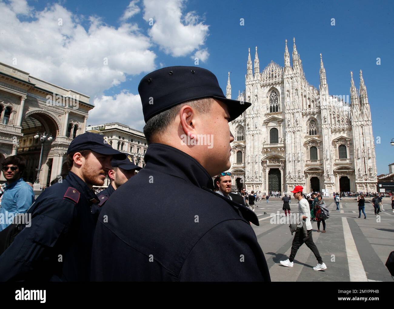 A Chinese Police officer, right, and two Italian Carabinieri ...