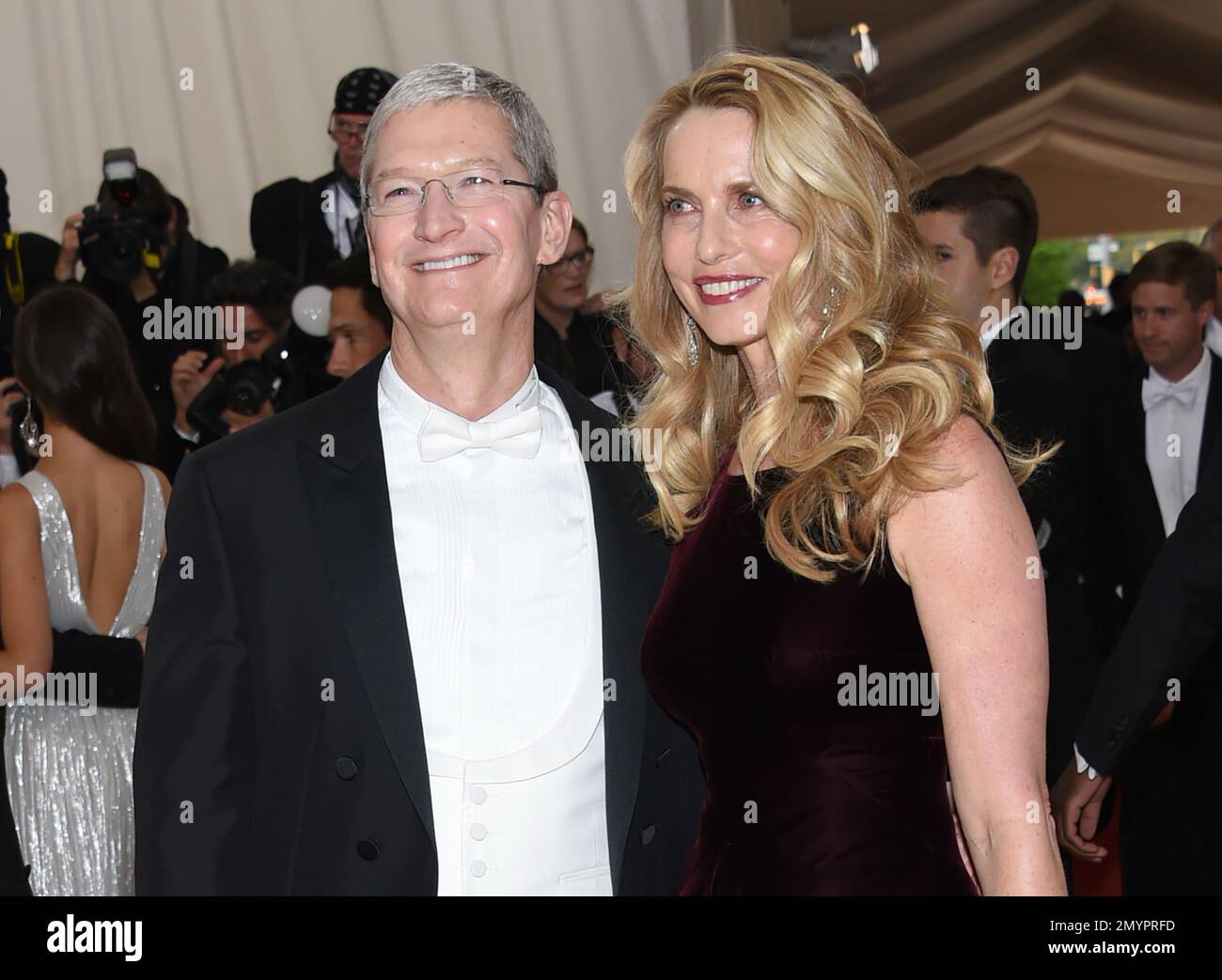 Apple CEO Tim Cook, left, and Laurene Powell arrive at The Metropolitan ...