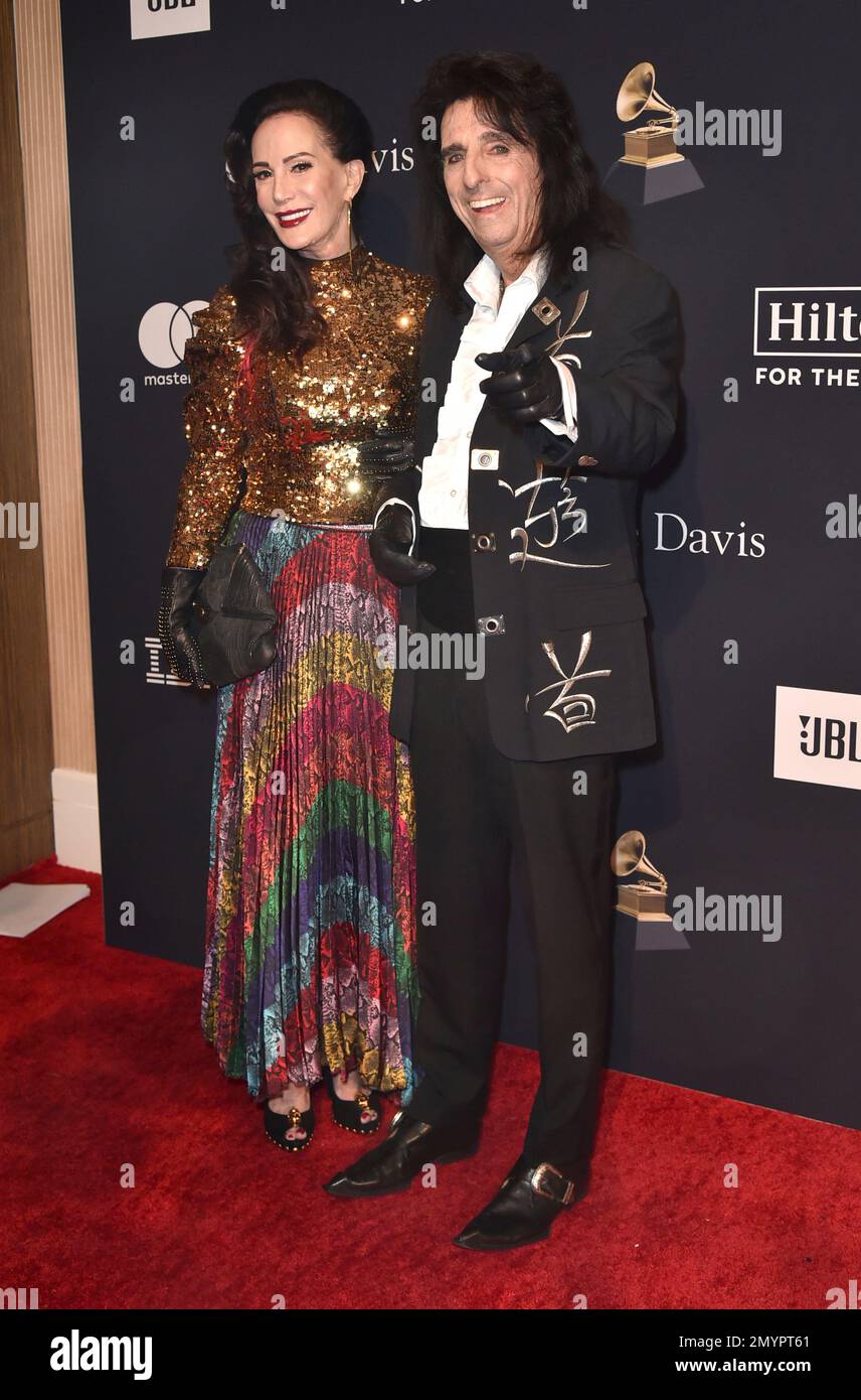 Sheryl Goddard, left, and Alice Cooper arrive at the Pre-Grammy Gala on ...