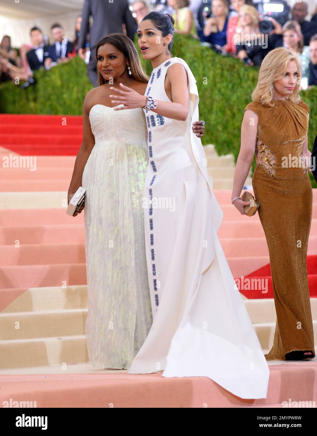 Mindy Kaling, left, and Freida Pinto arrive at The Metropolitan Museum ...