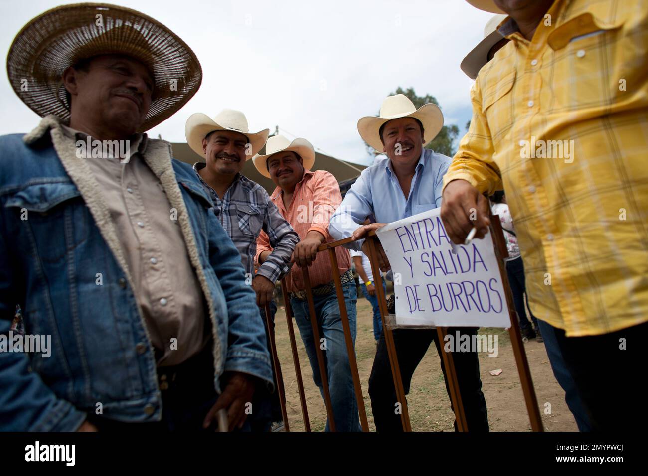 In this May 1, 2016 photo, men from a donkey racing team stand beside ...