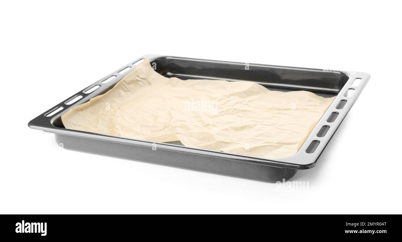 Baking sheet with paper isolated on white background Stock Photo - Alamy