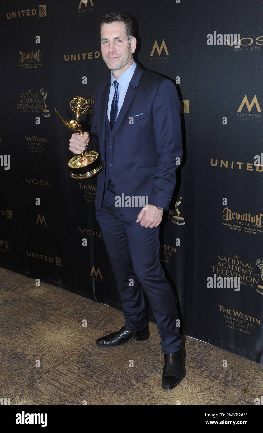 Frank Valentini poses in the pressroom with the award for outstanding ...
