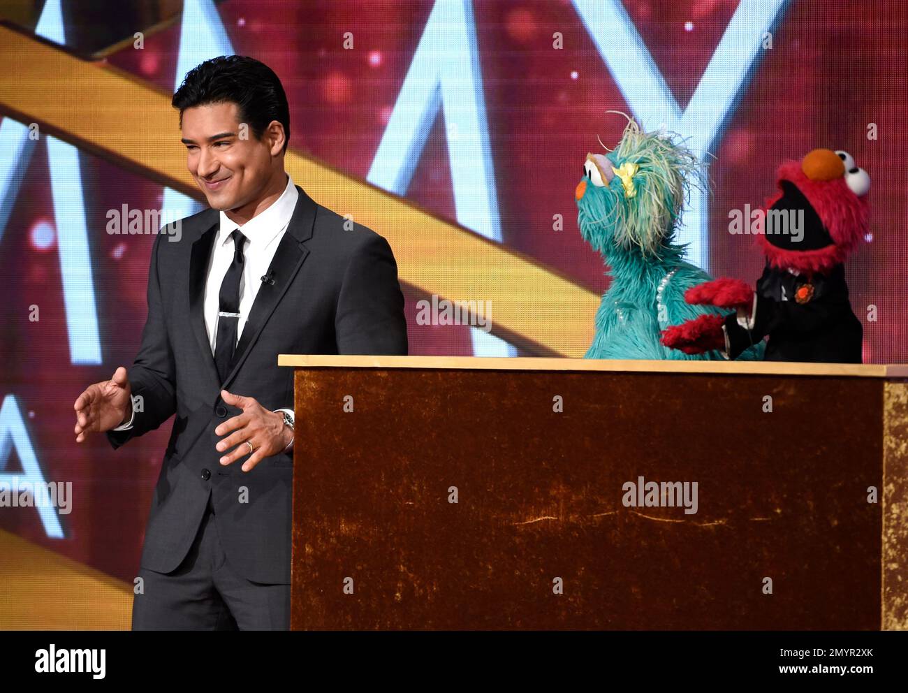 Mario Lopez, from left, Rosita, and Elmo present the Lifetime ...