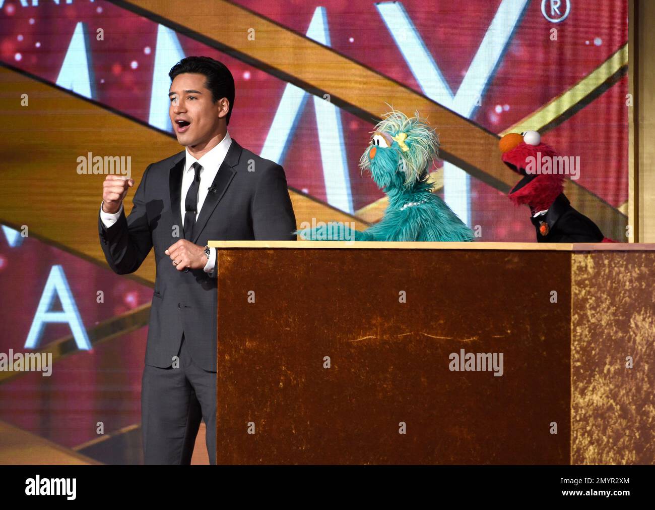 Mario Lopez, from left, Rosita, and Elmo present the Lifetime ...