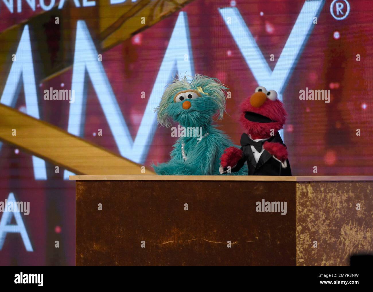 Rosita, left, and Elmo present the award for outstanding supporting ...
