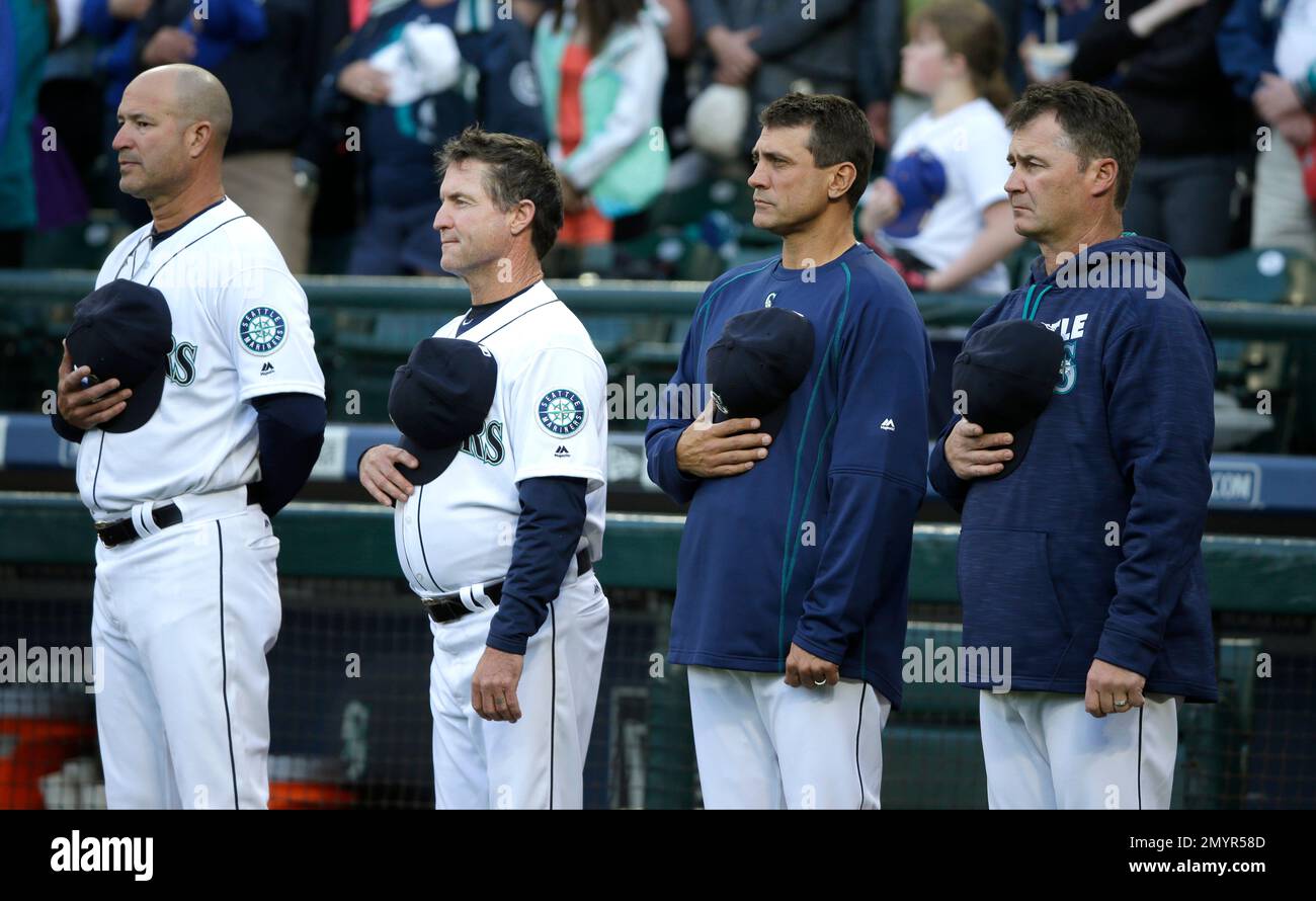 Seattle Mariners manager Scott Servais, right, stands with third base ...