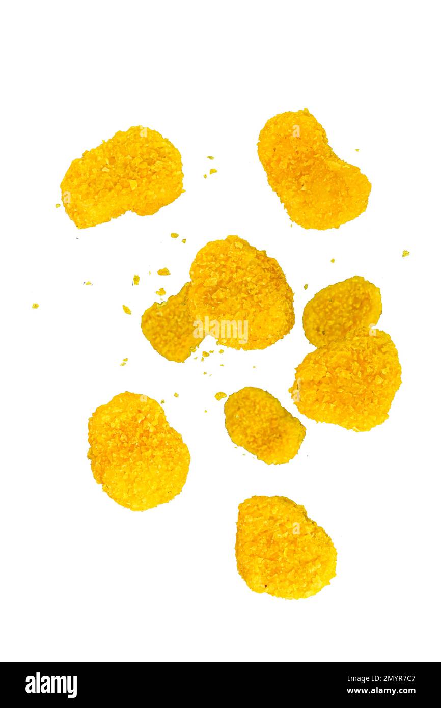 Freeze motion of flying chicken pieces on a white background. Concept ...