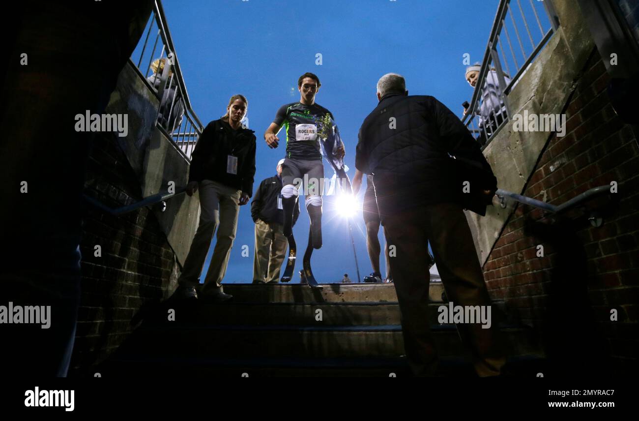 Nick Rogers walks off the track after winning the men's 200-meter ...